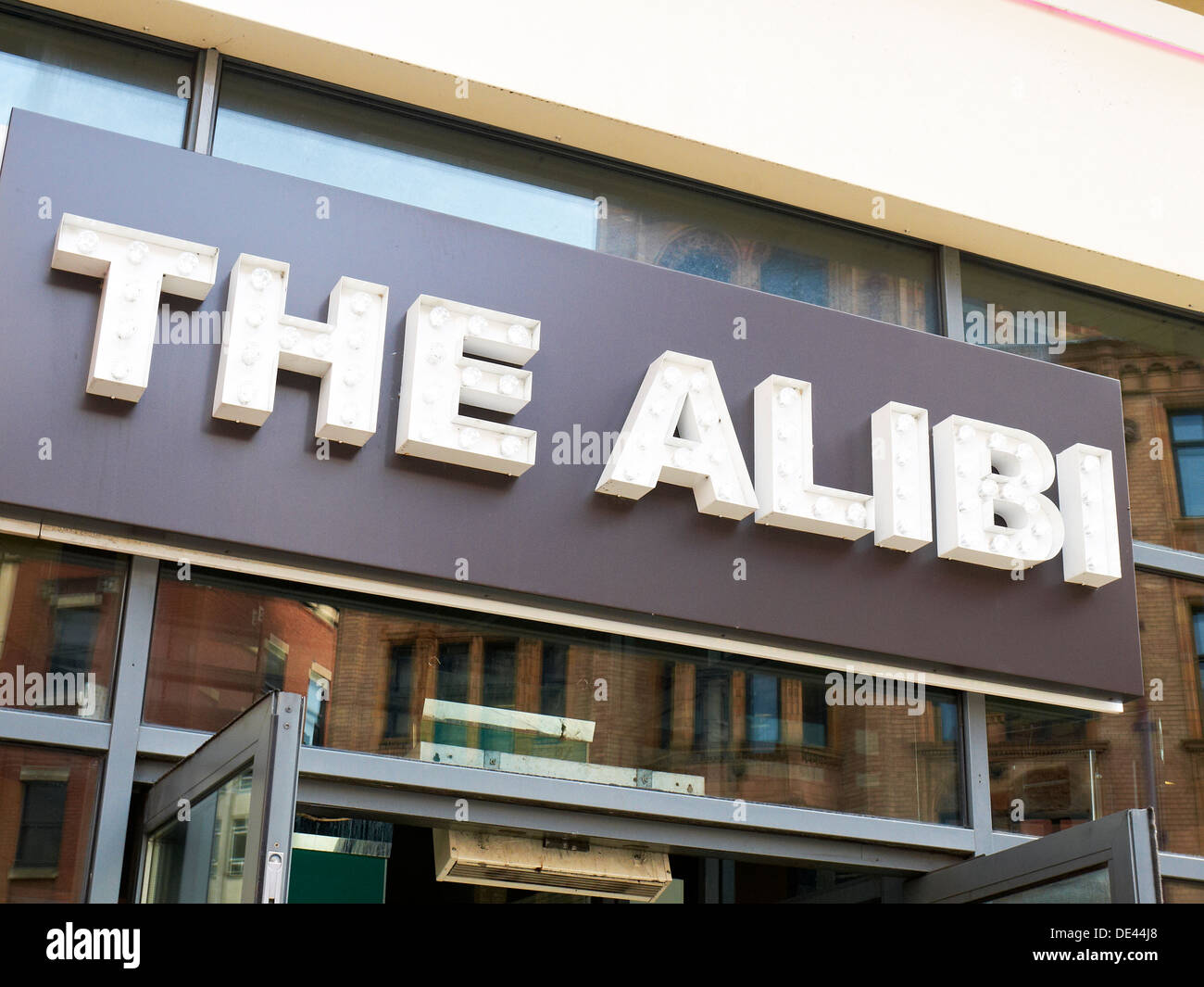 The Alibi pub sign on Oxford Street in Manchester UK Stock Photo - Alamy