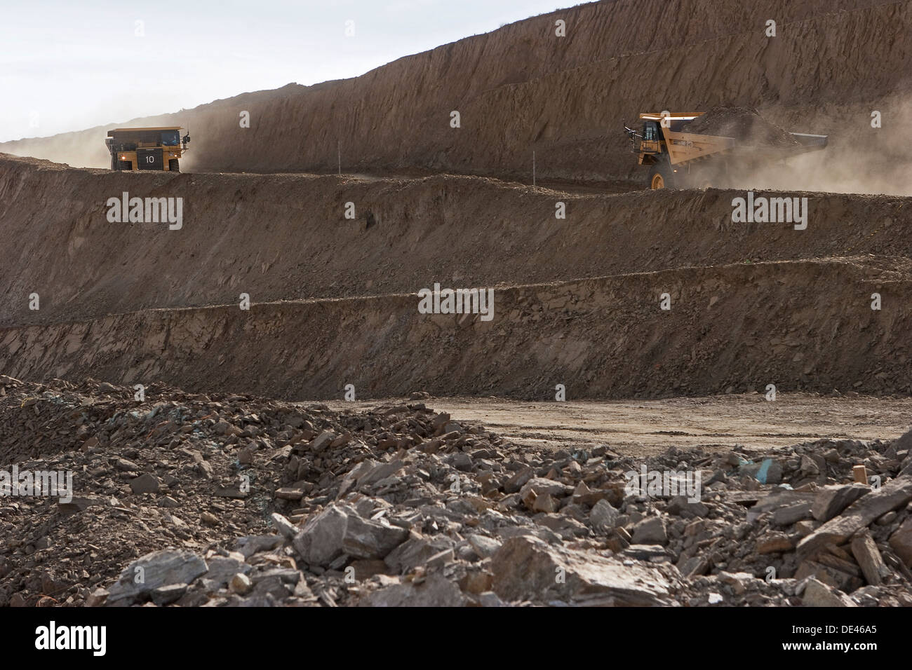 Trucks haul rock in open pit mine hi-res stock photography and images ...