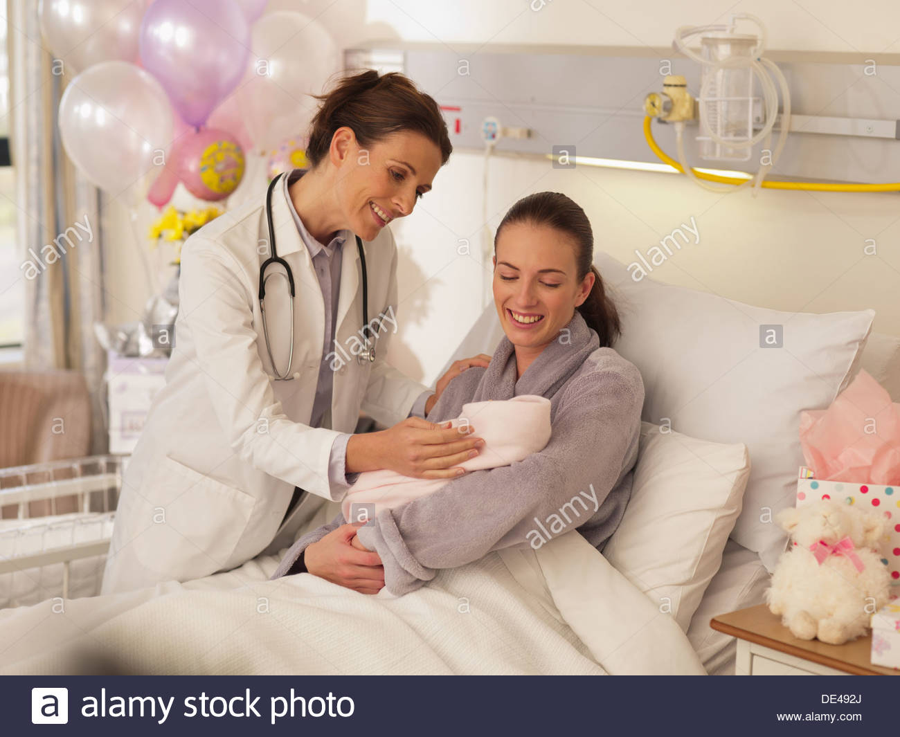Nurse Holding Baby Stock Photos & Nurse Holding Baby Stock Images - Alamy