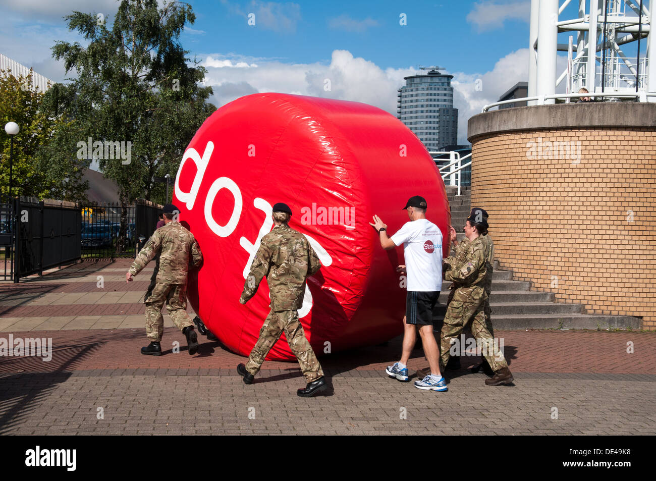 Forces personnel pushing the Big Red Wheel of the Stoptober 'stop ...