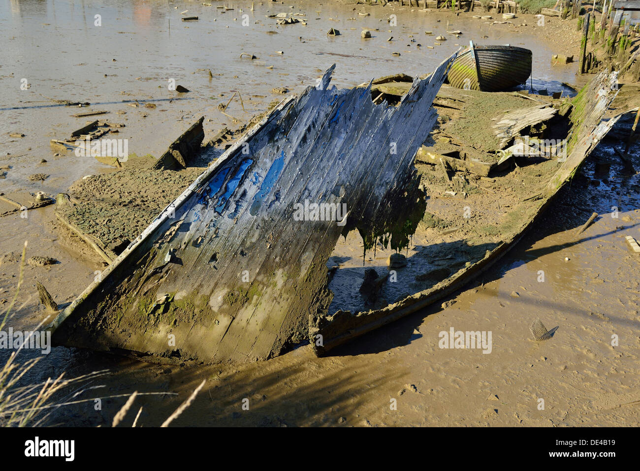Rotting boat hull in the mud , River Arun, Littlehampton Harbour, West ...