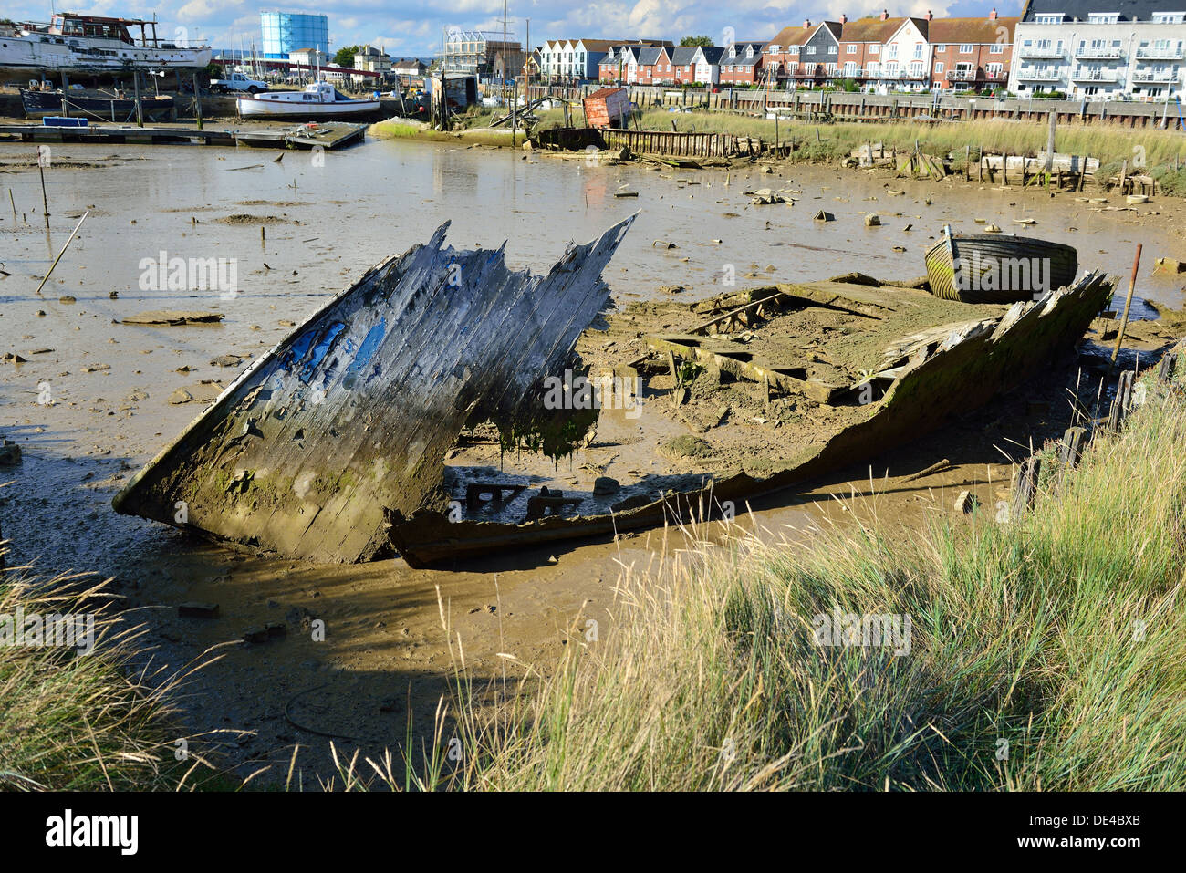 Rotting boat hull in the mud , River Arun, Littlehampton Harbour, West ...