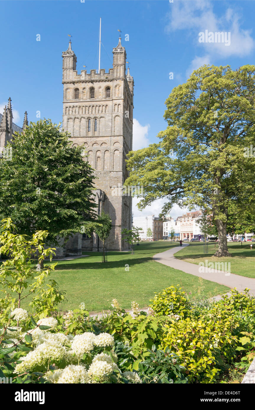Exeter cathedral tower seen across Cathedral Green, Devon, England, UK ...