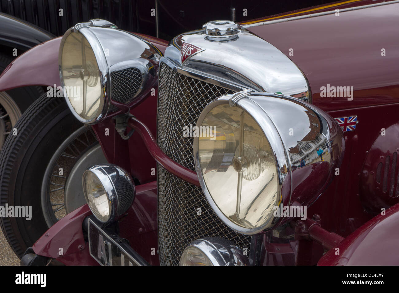 A closeup view of the lights on the front of an Alvis Speed 20 Tourer ...