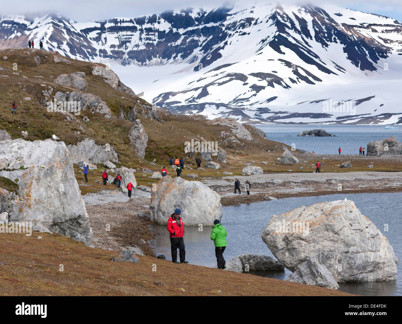 Tourists exploring the coast of Hornsund, Spitsbergen Island, Svalbard ...