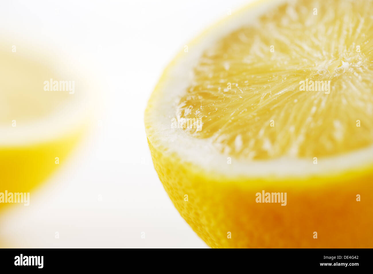 A fresh organic lemon photographed in an abstract manner on a white ...