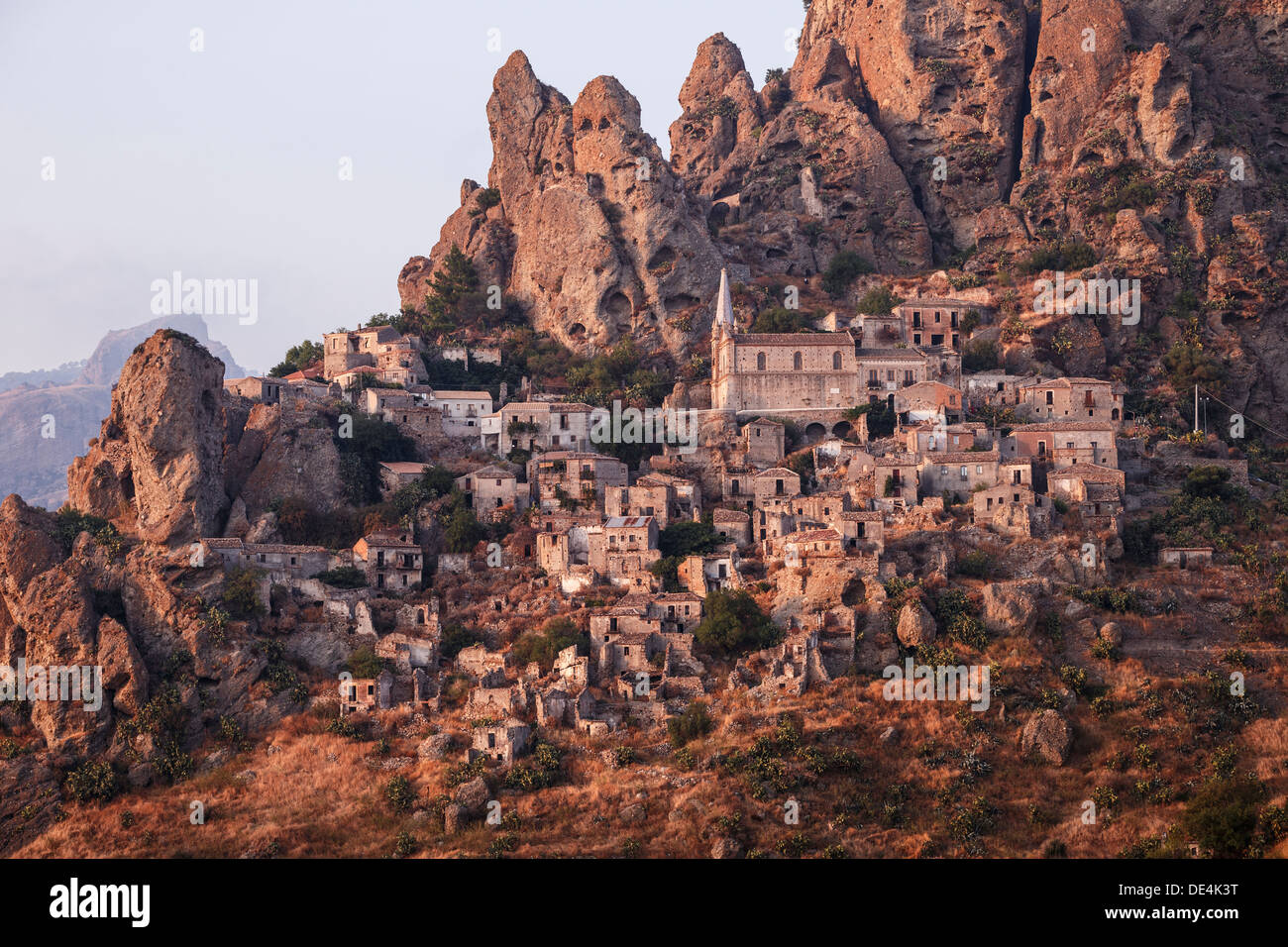 The abandoned village of Pentedattilo at sunset Stock Photo - Alamy