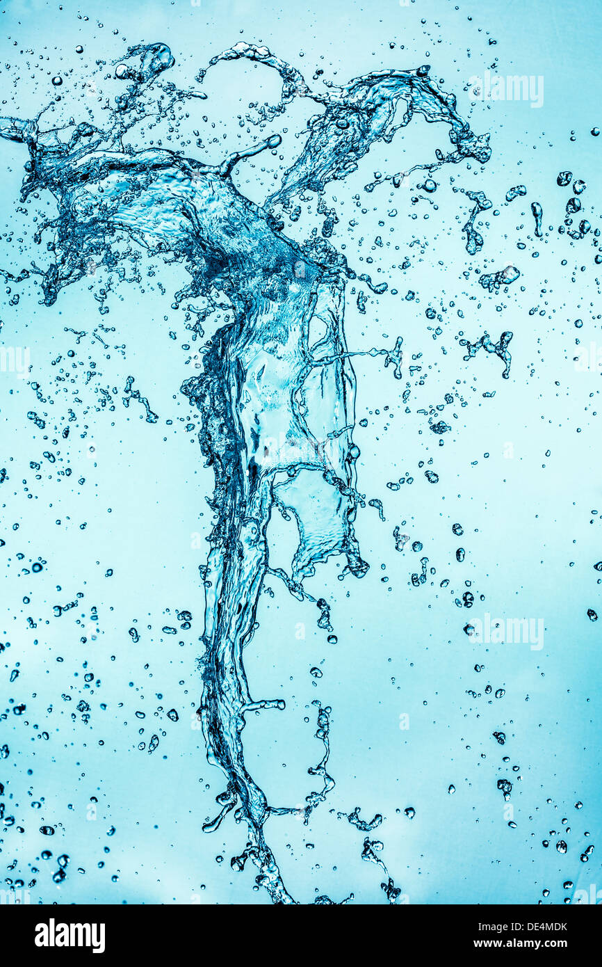 Abstract water splash on blue background Stock Photo - Alamy
