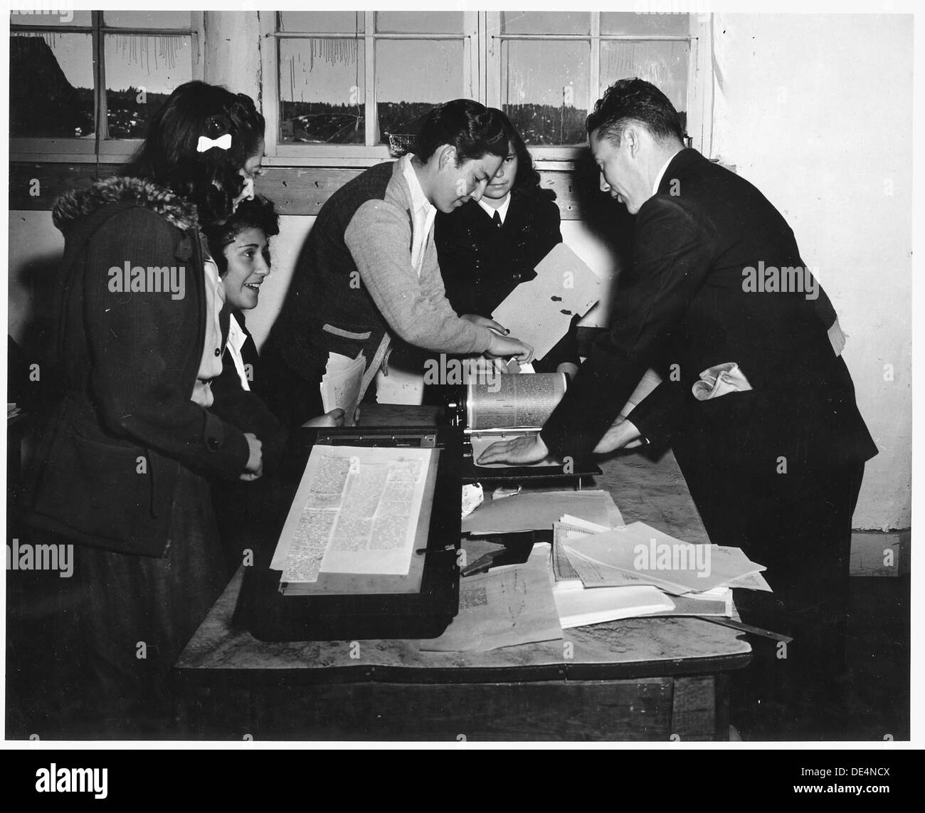This photograph shows students mimeographing school papers at a high ...