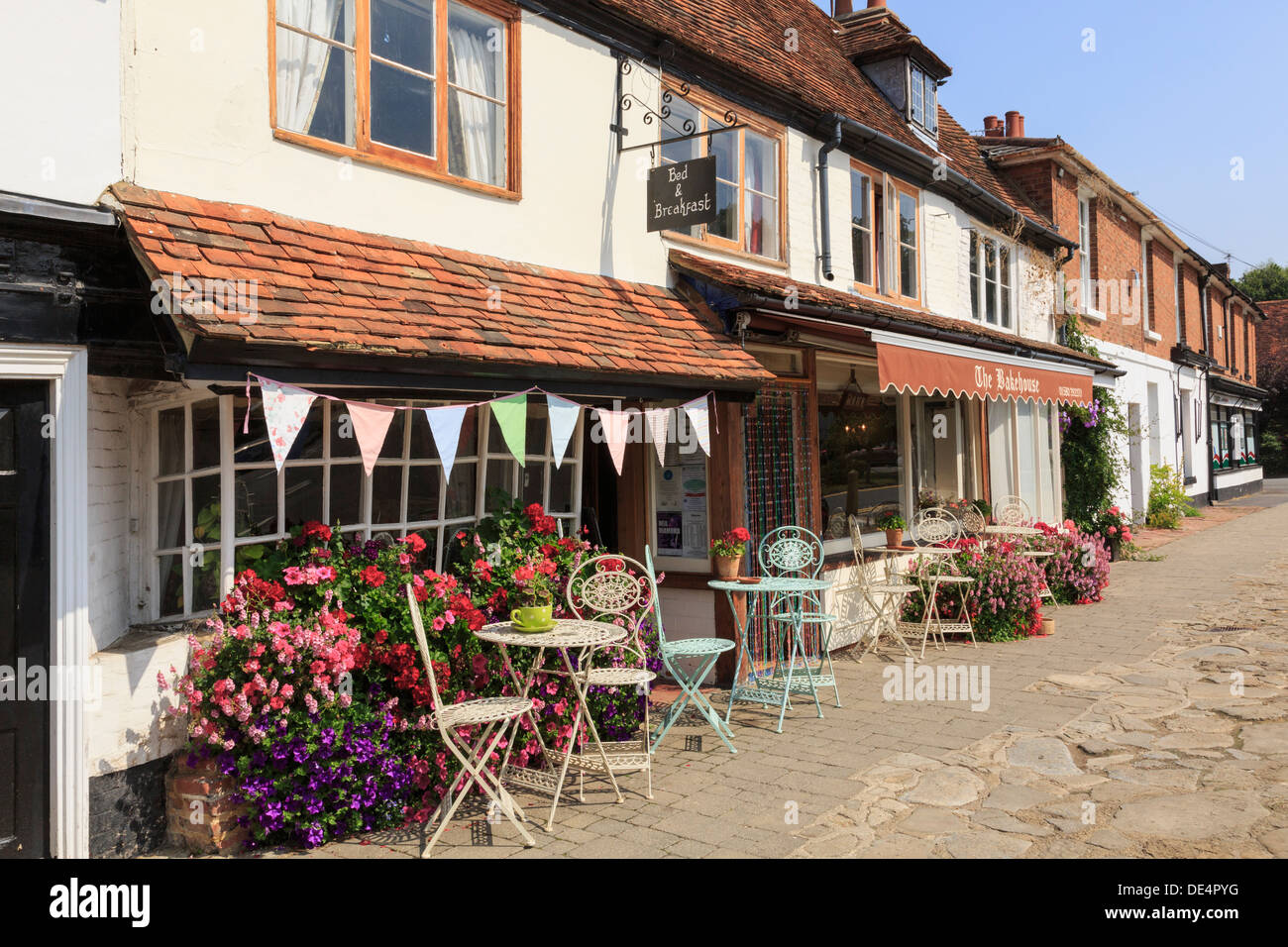 Chairs and tables outside The Bakehouse cafe on the main street in ...