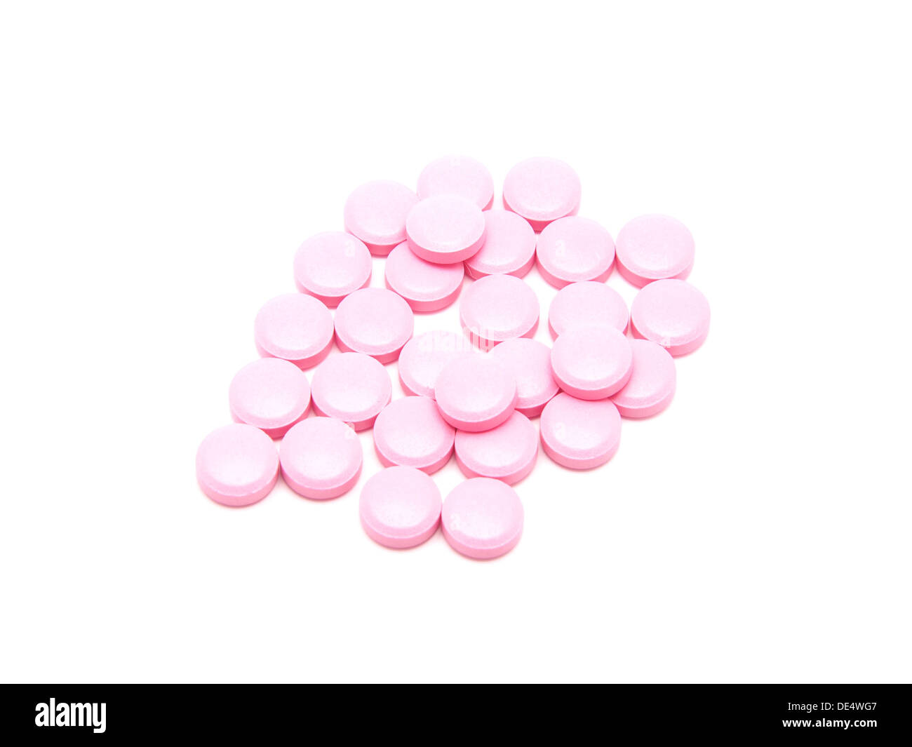 Pink tablets on a white background Stock Photo - Alamy