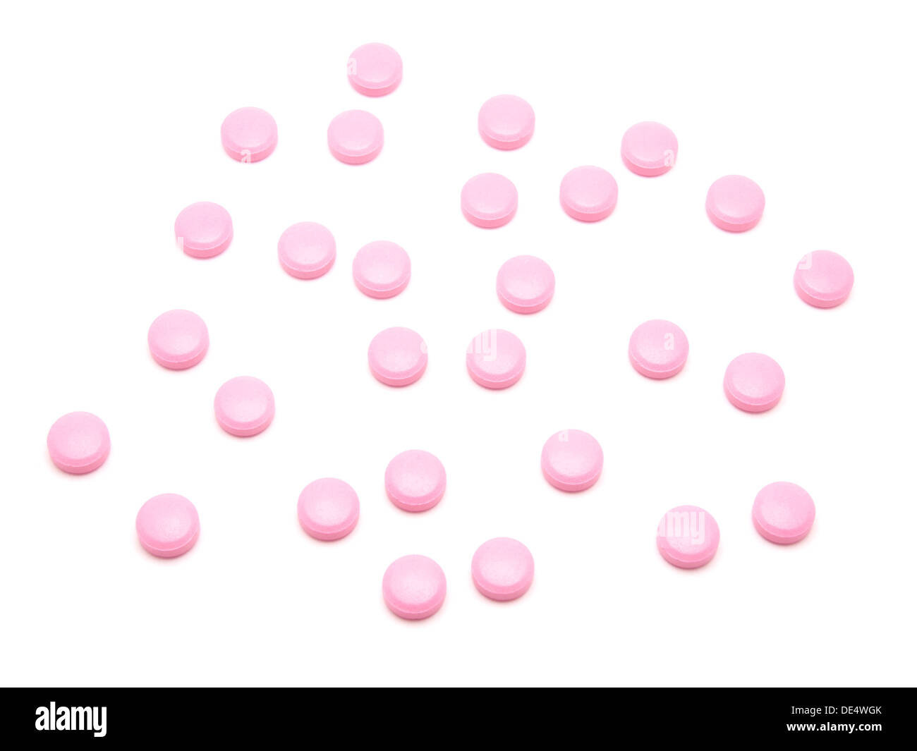 Pink tablets on a white background Stock Photo - Alamy