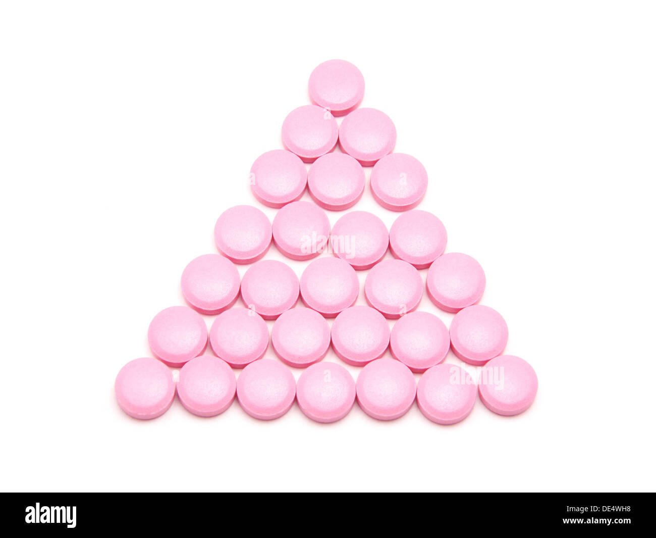 Pink tablets on a white background Stock Photo - Alamy
