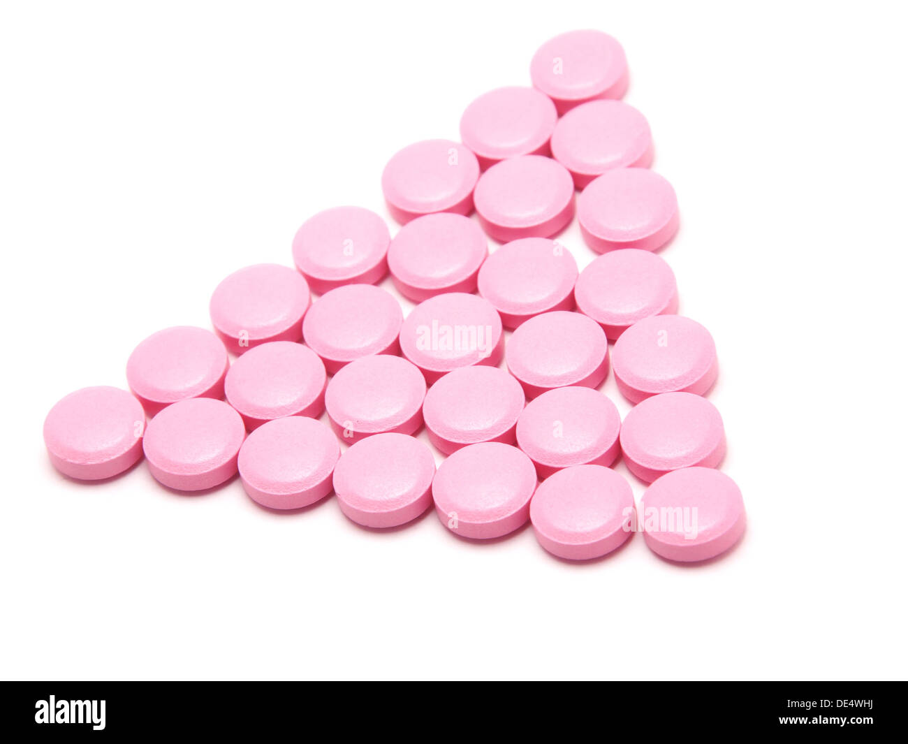 Pink tablets on a white background Stock Photo - Alamy