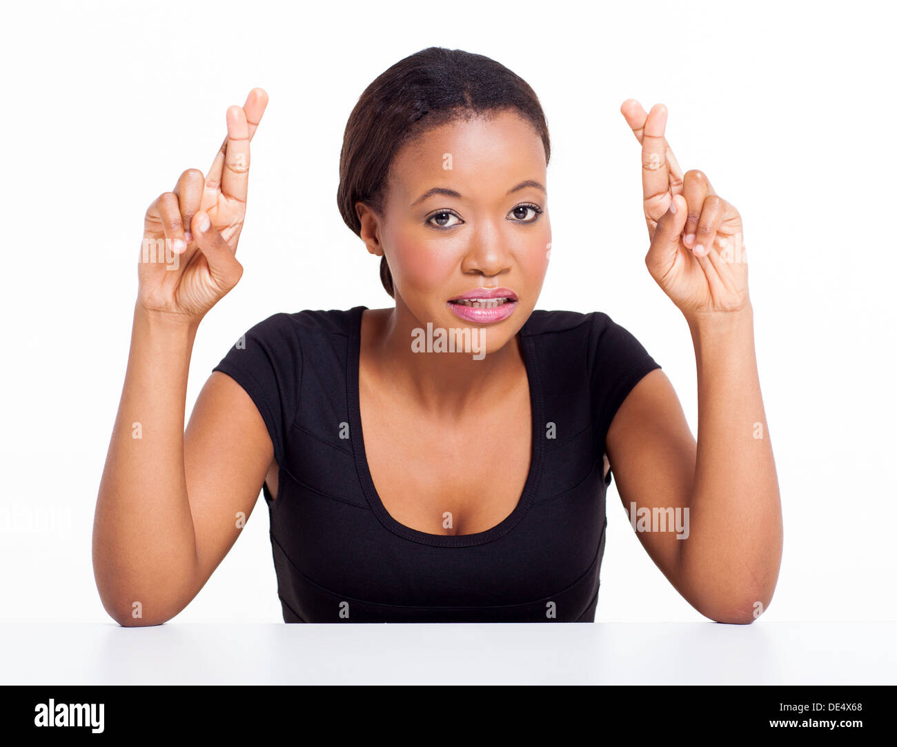 Fingers crossed woman hi-res stock photography and images - Alamy