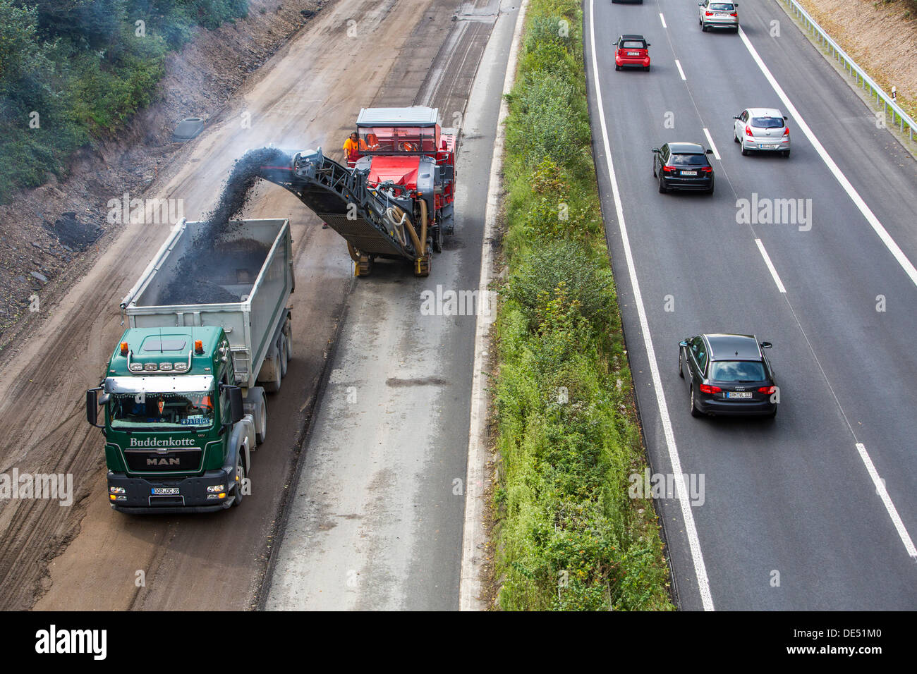 Roadworks, on Autobahn A52, Essen, Germany. Removal of the asphalt ...
