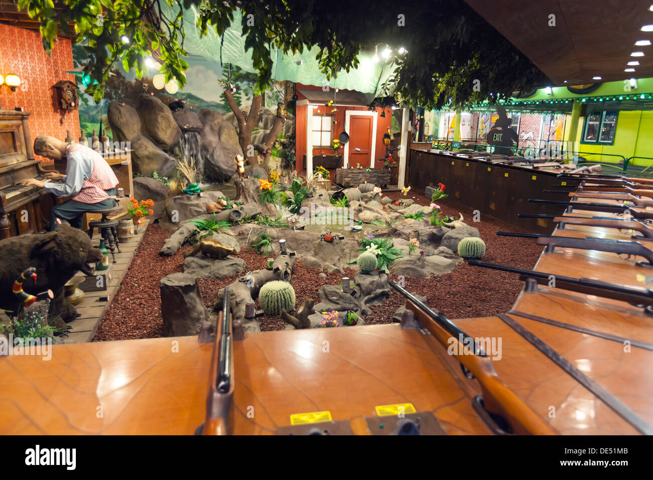 A rifle range target practice game in an arcade on an ocean boardwalk ...