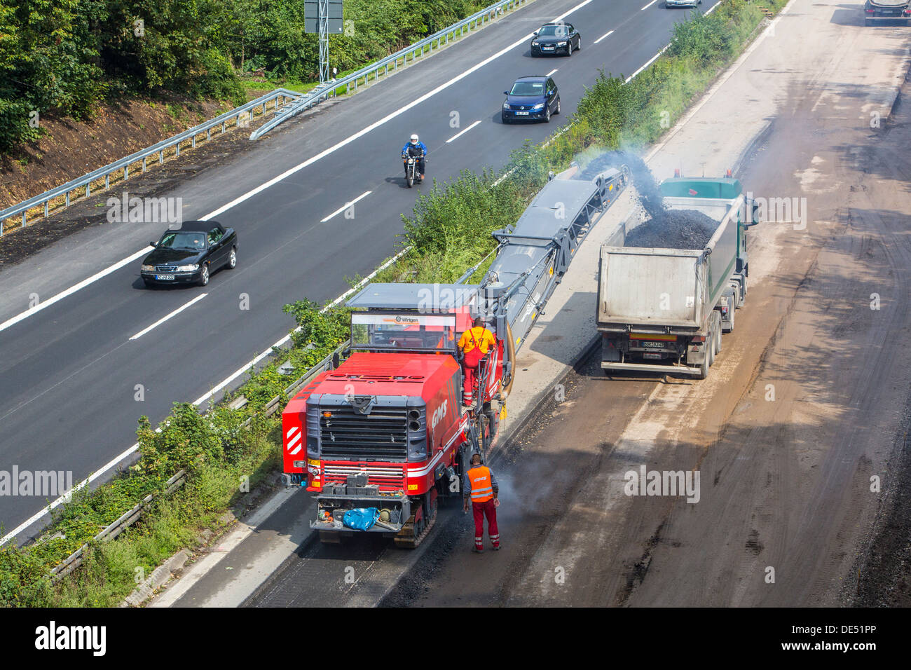 Roadworks, on Autobahn A52, Essen, Germany. Removal of the asphalt ...