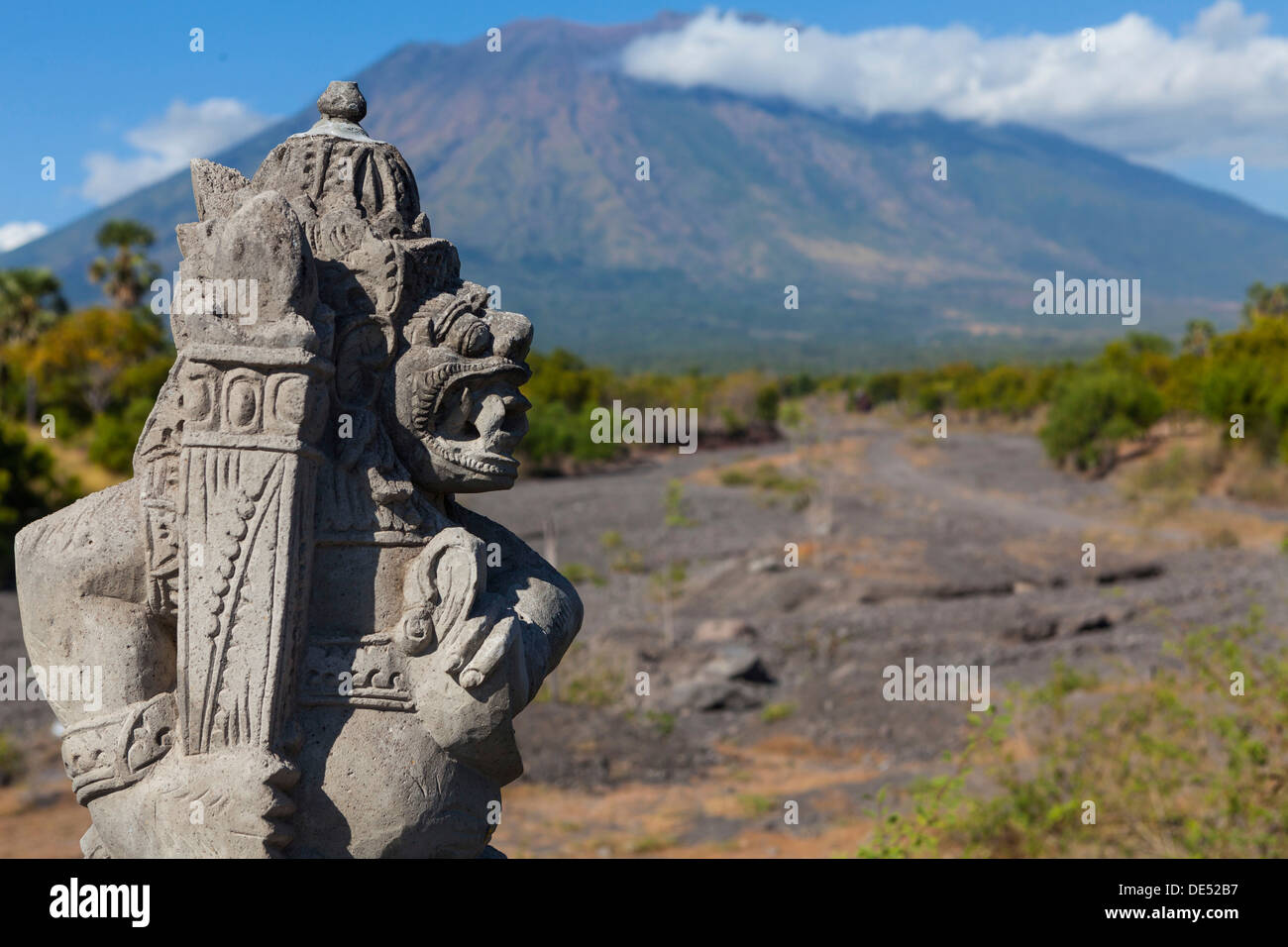 Balinese stone statue, the Gunung Agung volcano at back, Batang ...