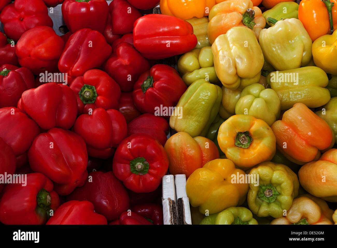 Red yellow & green bell peppers in a market in Israel Stock Photo - Alamy
