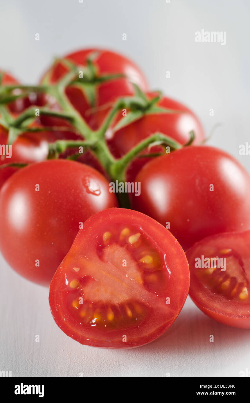 Tomatos on vine Stock Photo - Alamy