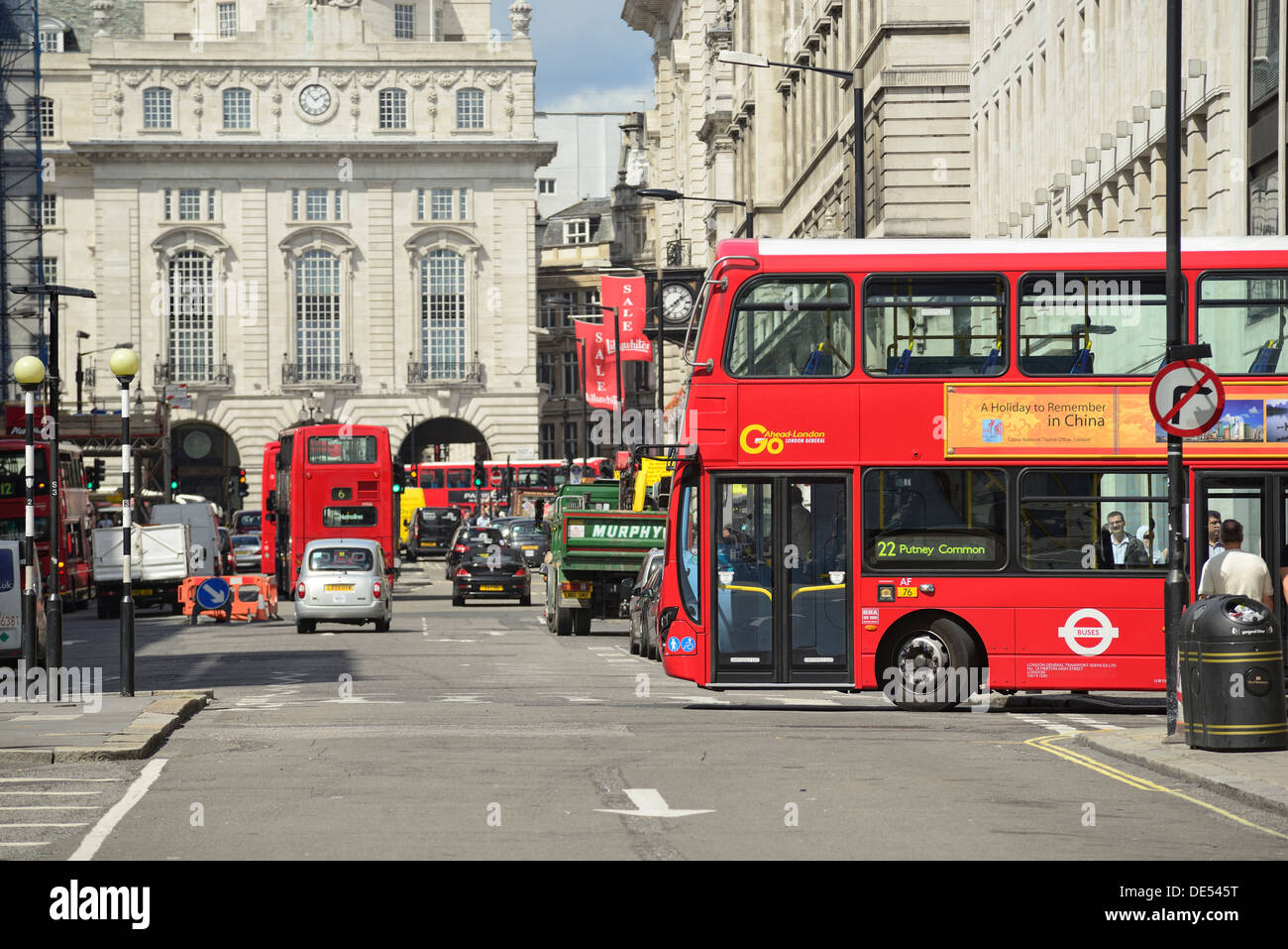 Busy London street with typical red double decker buses Stock Photo - Alamy