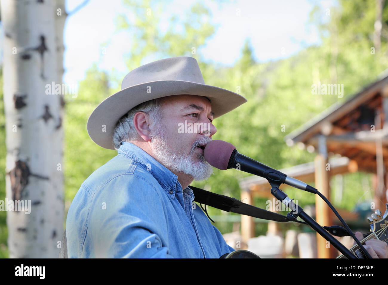 country and western singer performs outdoors in ranch setting Stock ...