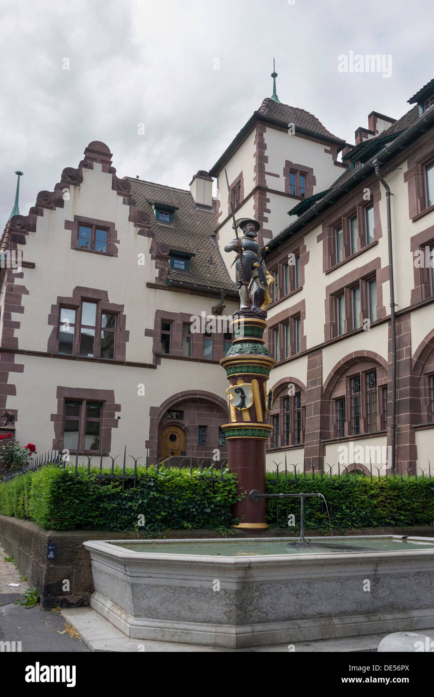 Fountain with the statue of a medieval warrior, Old Basel, Switzerland ...