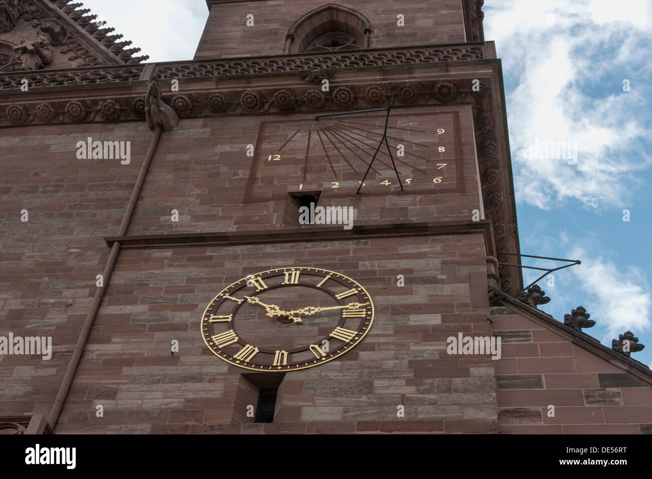 Clock and sundial, Basel Munster, Basel, Switzerland Stock Photo - Alamy