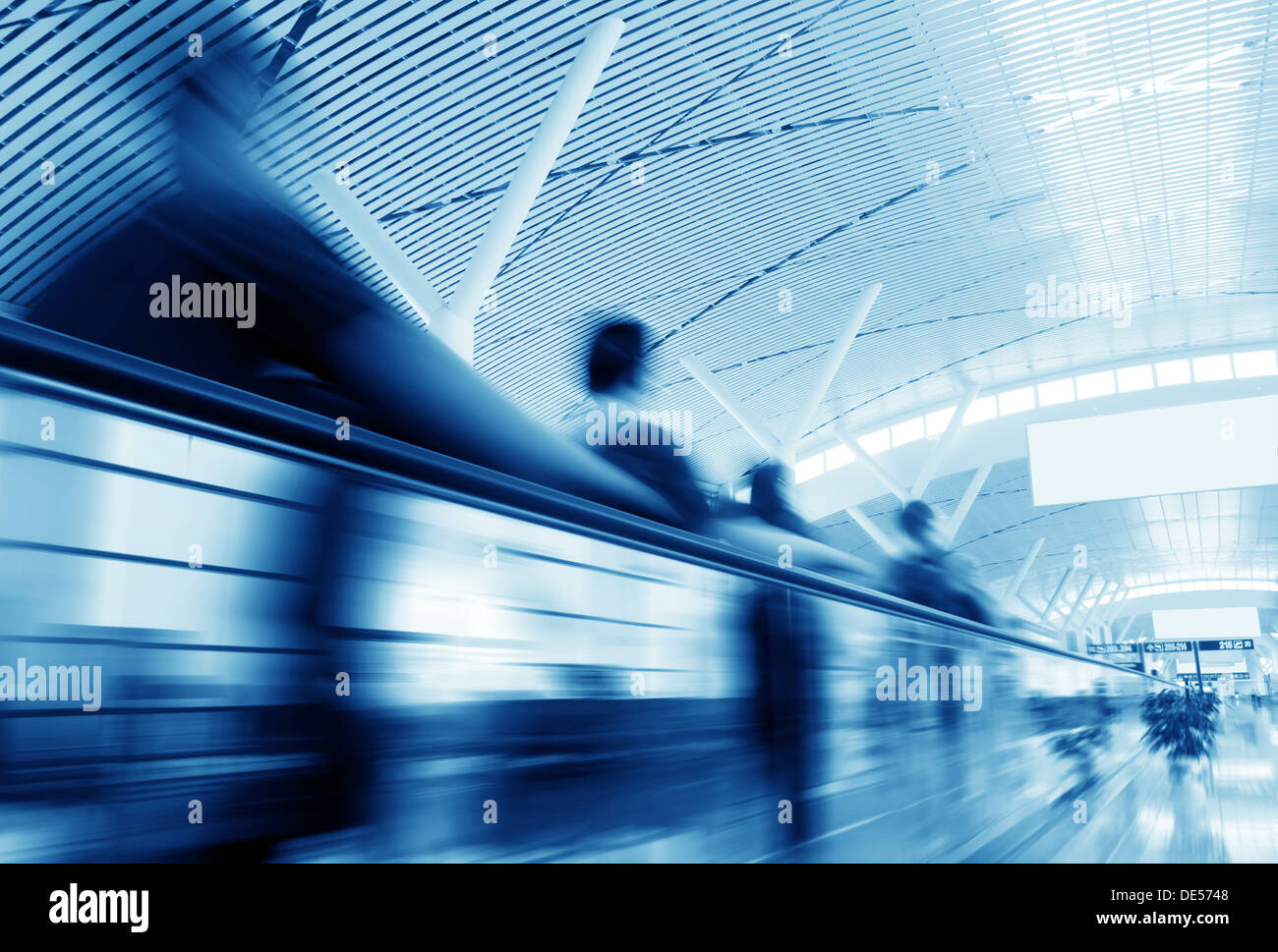 passenger rushing through an escalator in airport terminal Stock Photo ...