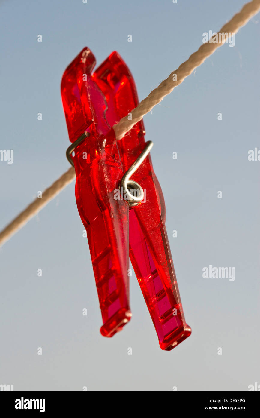 Red peg on a clothesline Stock Photo - Alamy