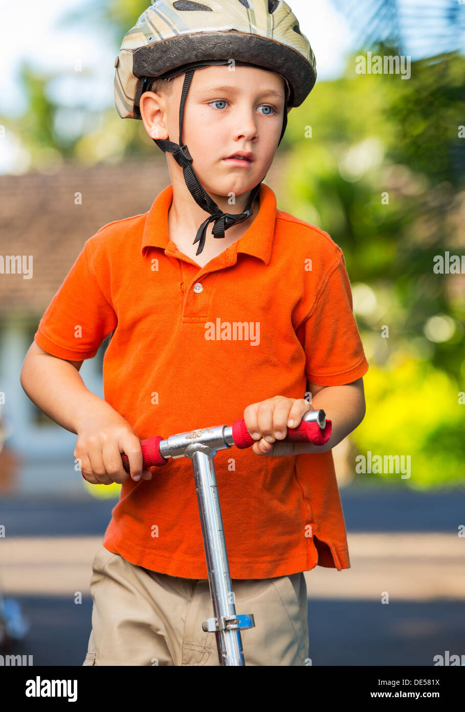 Cute Young Boy with Scooter Stock Photo - Alamy