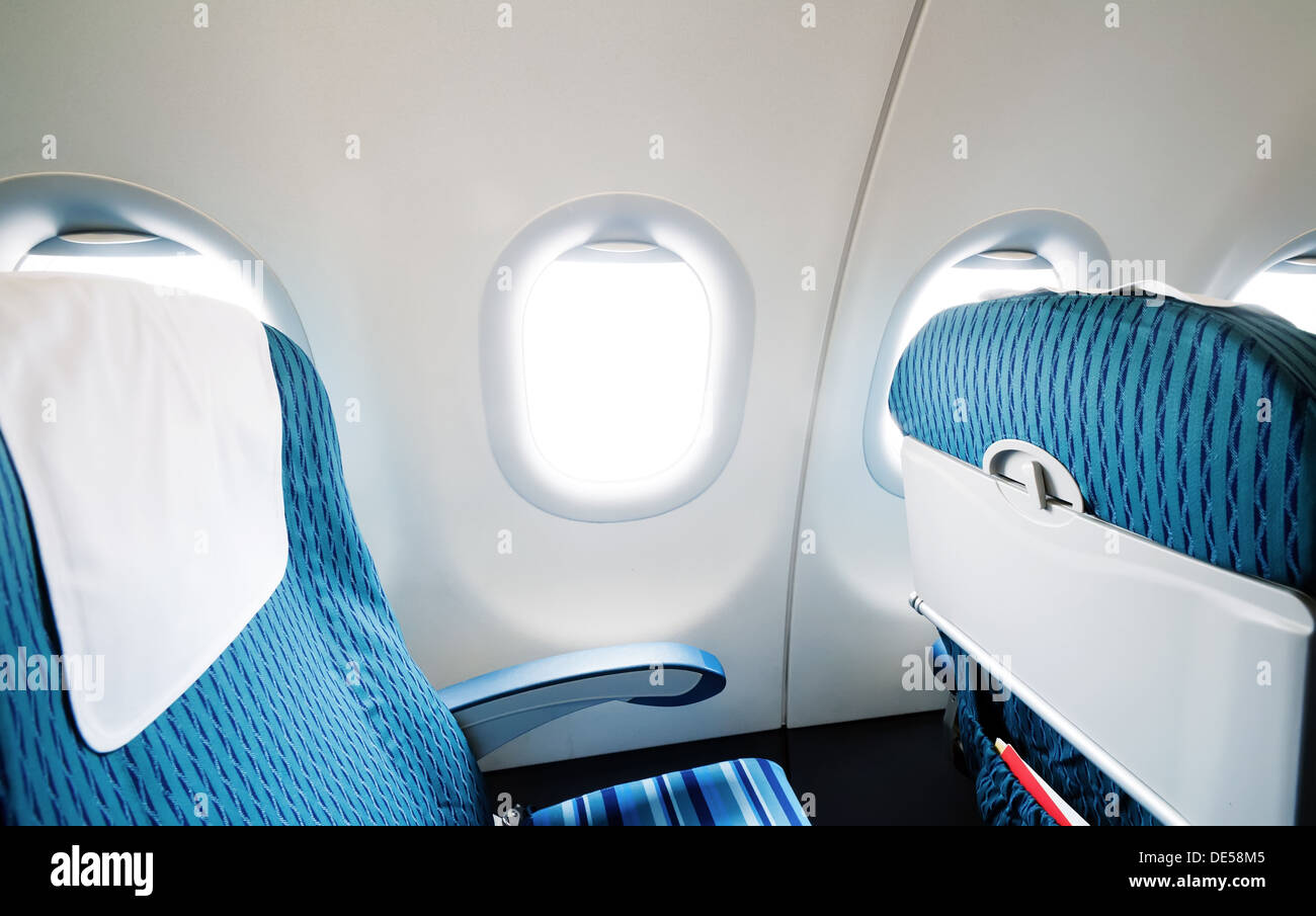 Empty aircraft seats and windows Stock Photo - Alamy