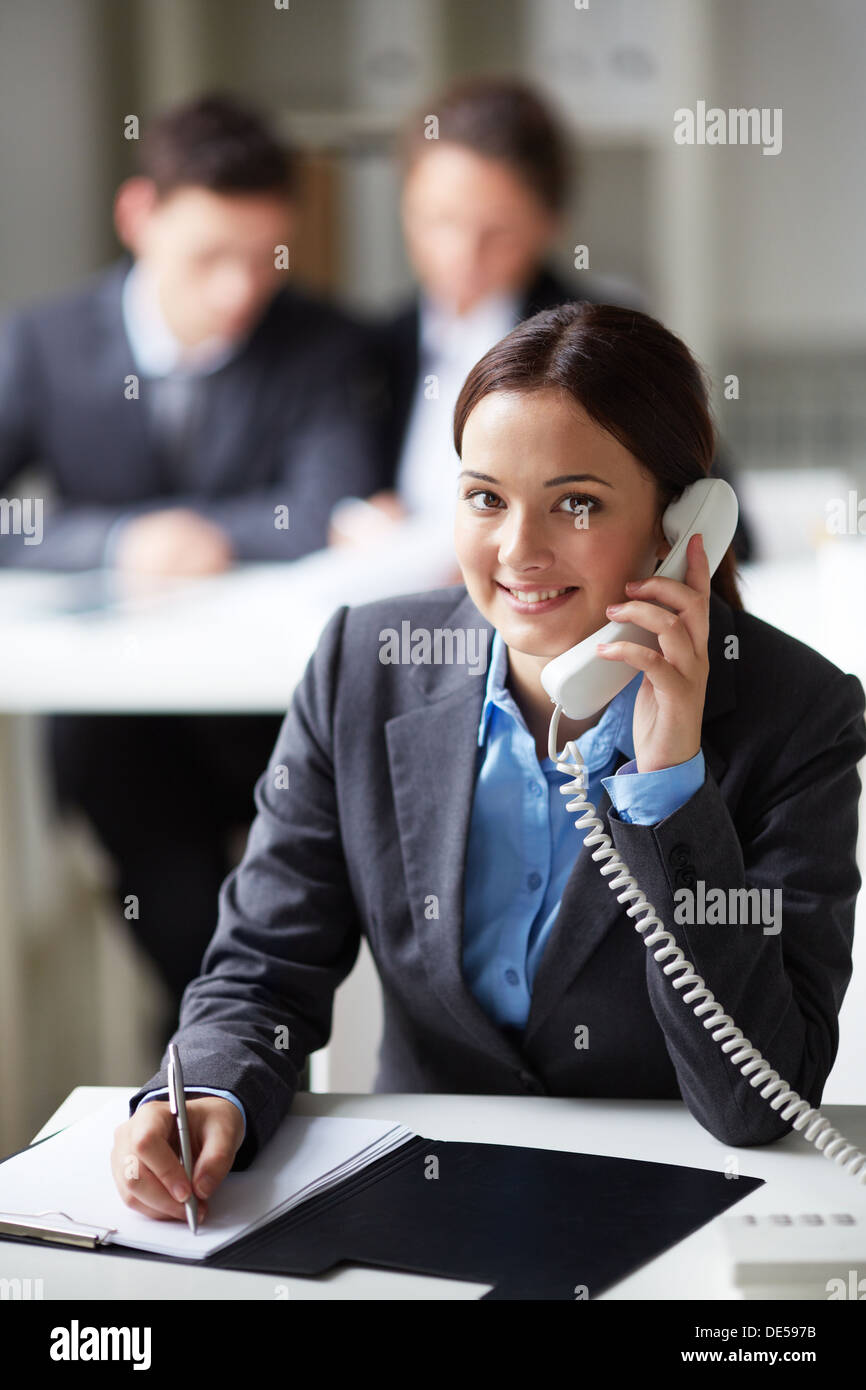 Portrait of smart businesswoman calling on the phone on background of ...