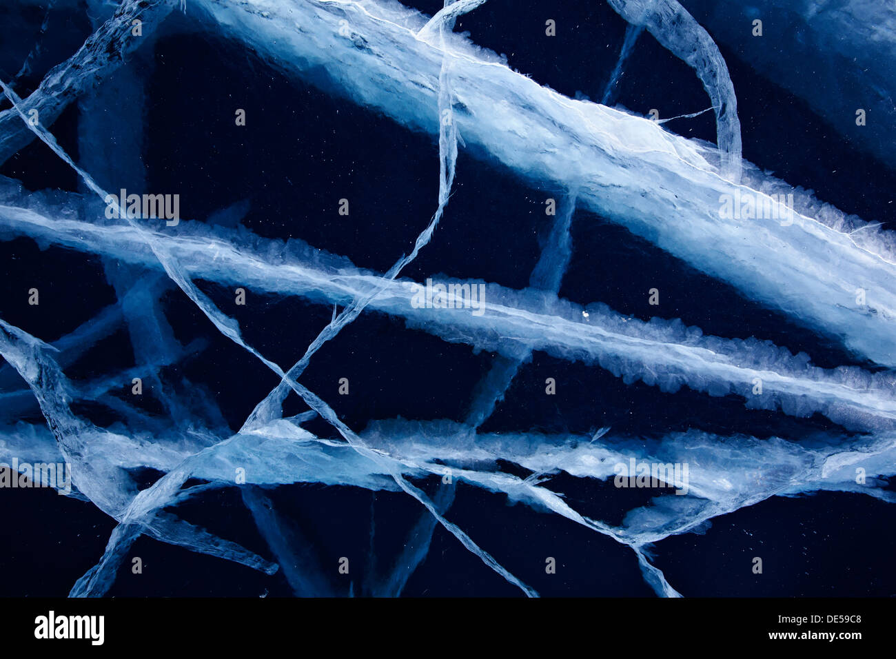 frozen clear ice of Baikal lake with many cracks Stock Photo - Alamy