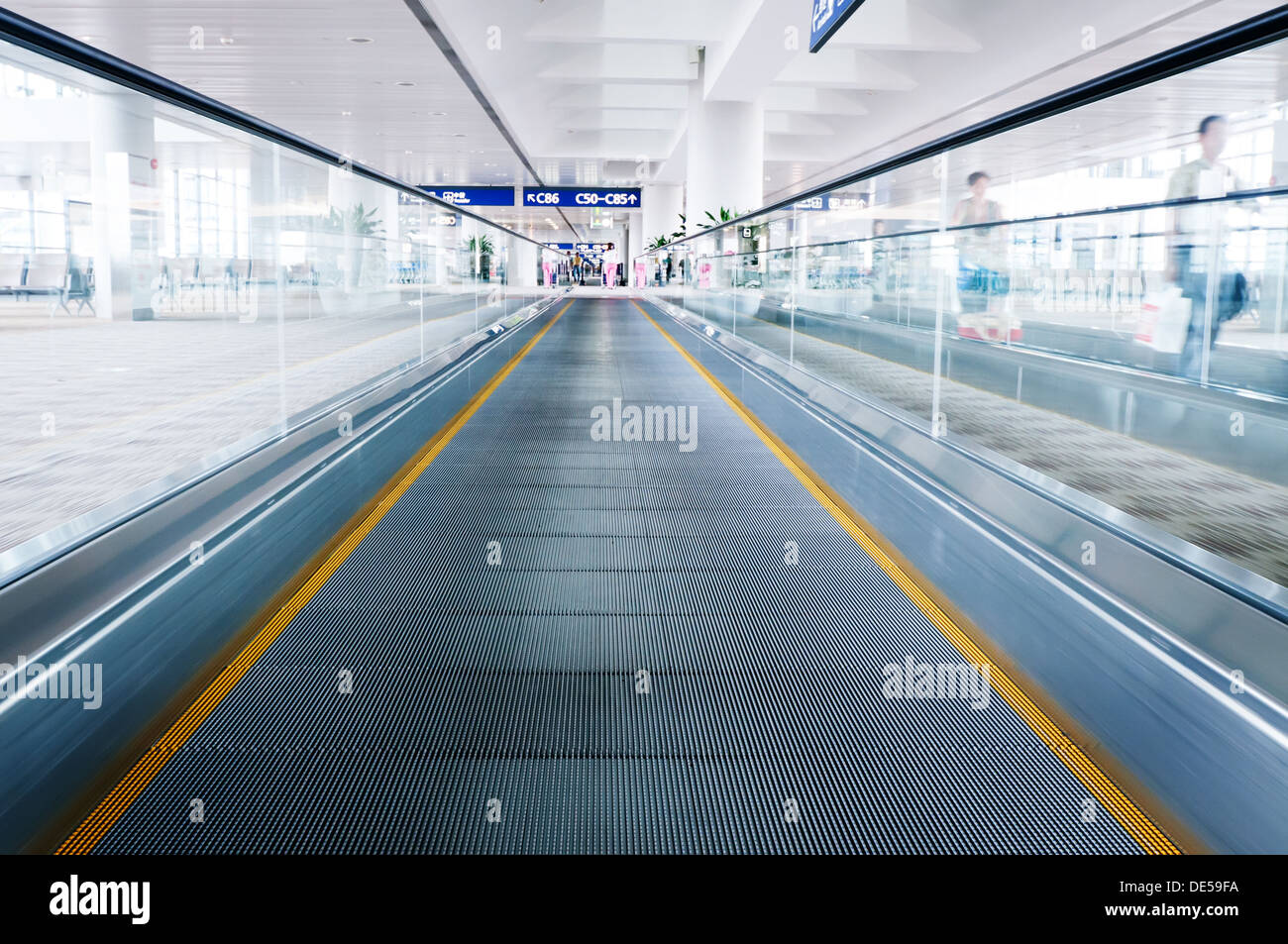 passenger rushing through an escalator in airport terminal Stock Photo ...
