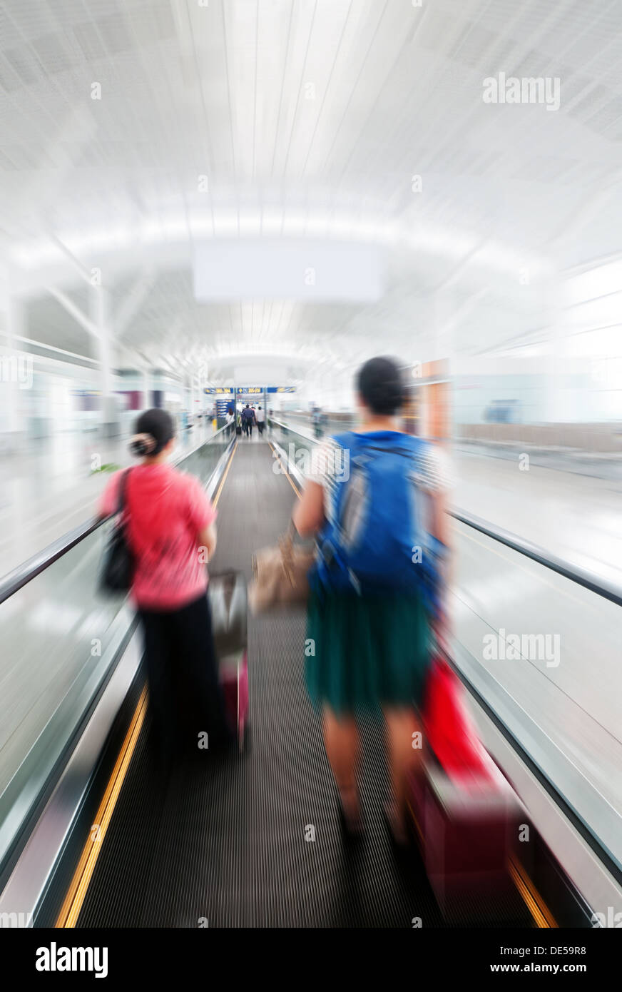 passenger rushing through an escalator in airport terminal Stock Photo ...