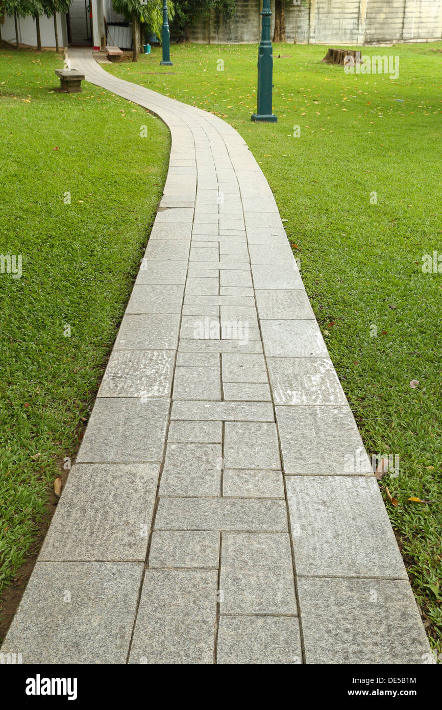 Paving stone road green grass hi-res stock photography and images - Alamy