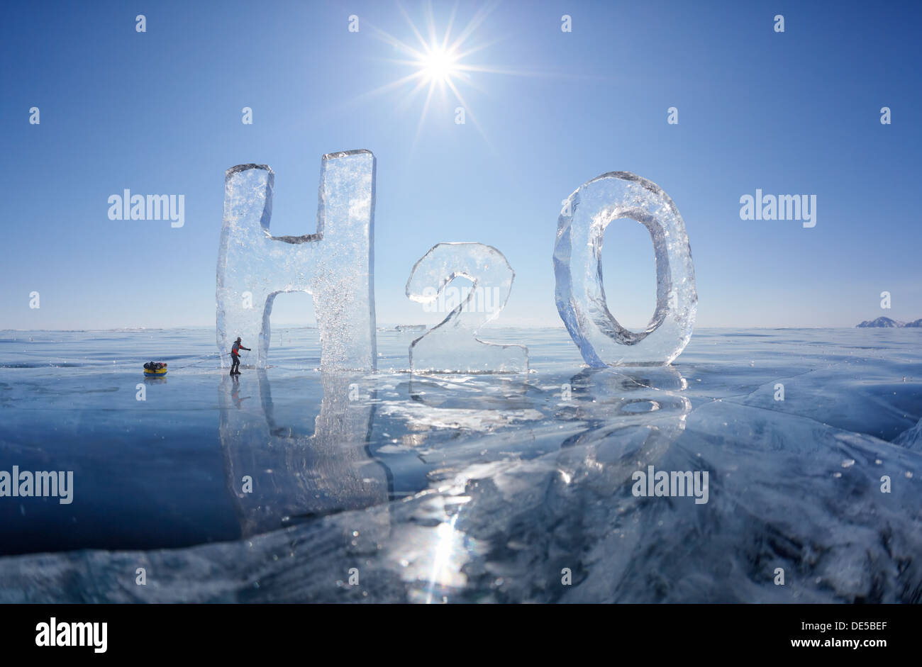 Chemical formula of water H2O made from ice on winter frozen lake ...