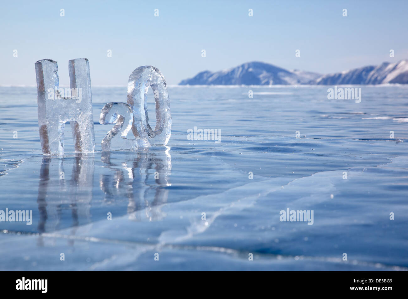 Chemical formula of water H2O made from ice on winter frozen lake ...