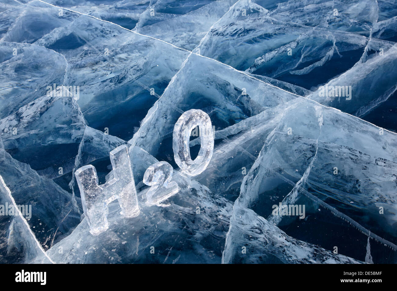 Chemical formula of water H2O made from ice on winter frozen lake ...