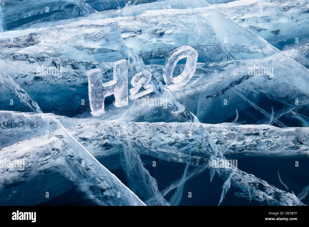 Chemical formula of water H2O made from ice on winter frozen lake ...