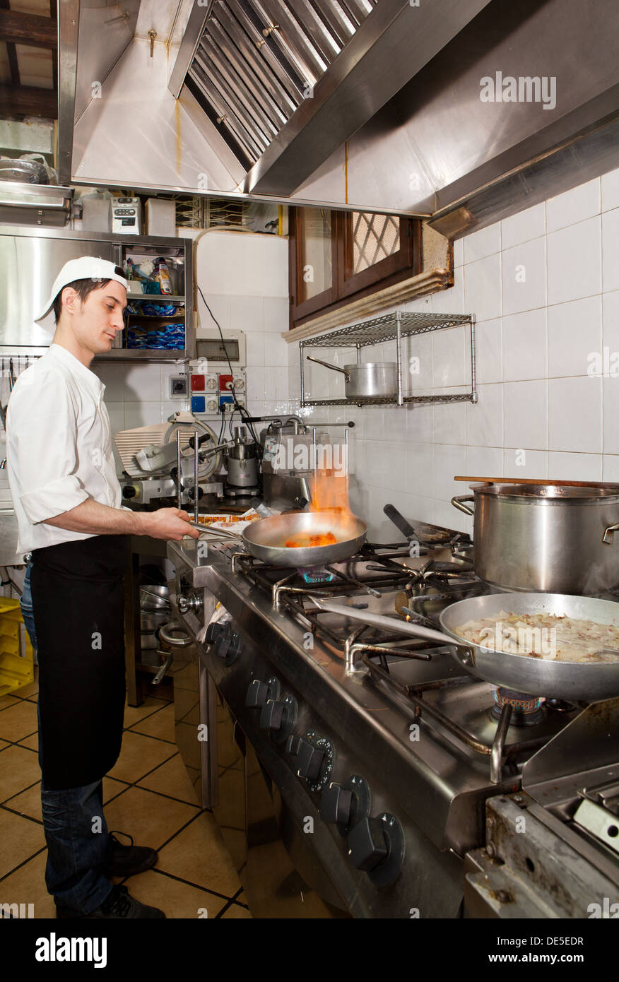 Food being prepared in a restaurant kitchen Stock Photo - Alamy