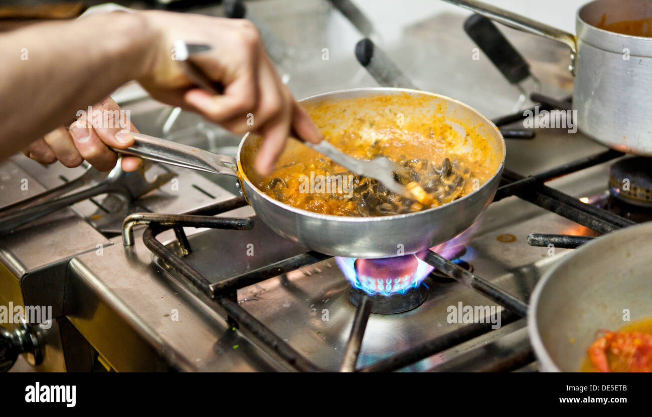 Food being prepared in a restaurant kitchen Stock Photo - Alamy
