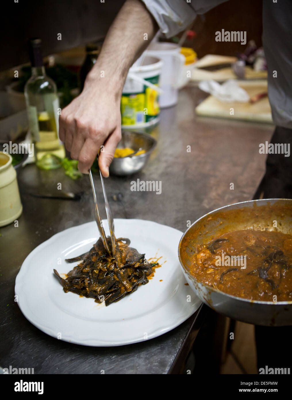 Food being prepared in a restaurant kitchen Stock Photo - Alamy