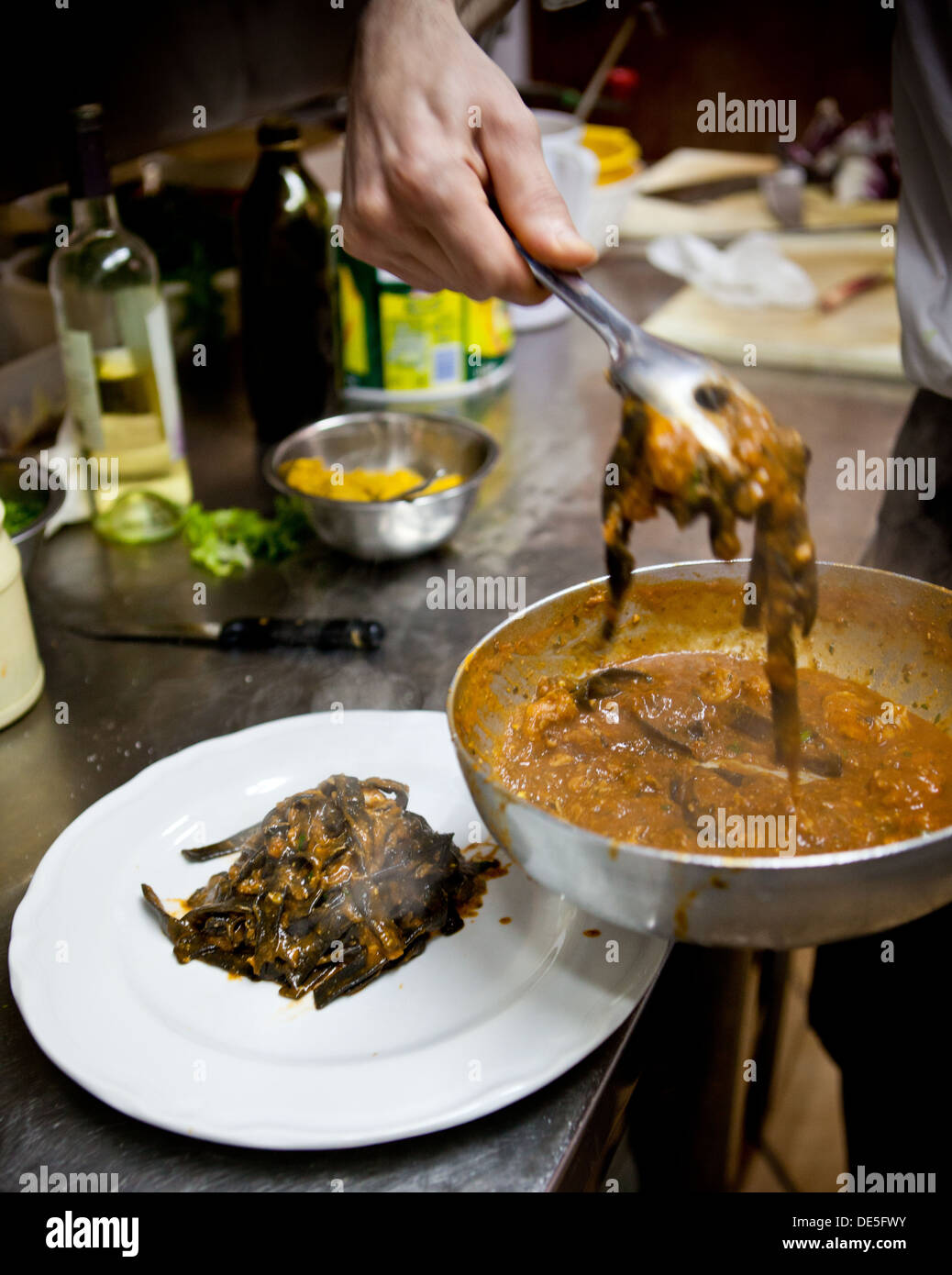 Food being prepared in a restaurant kitchen Stock Photo - Alamy