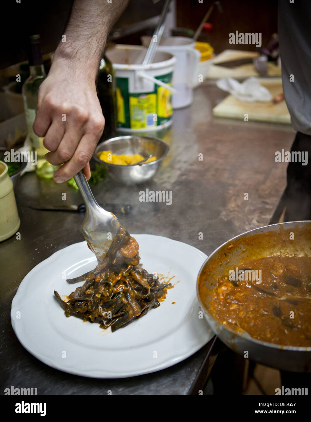 Food being prepared in a restaurant kitchen Stock Photo - Alamy