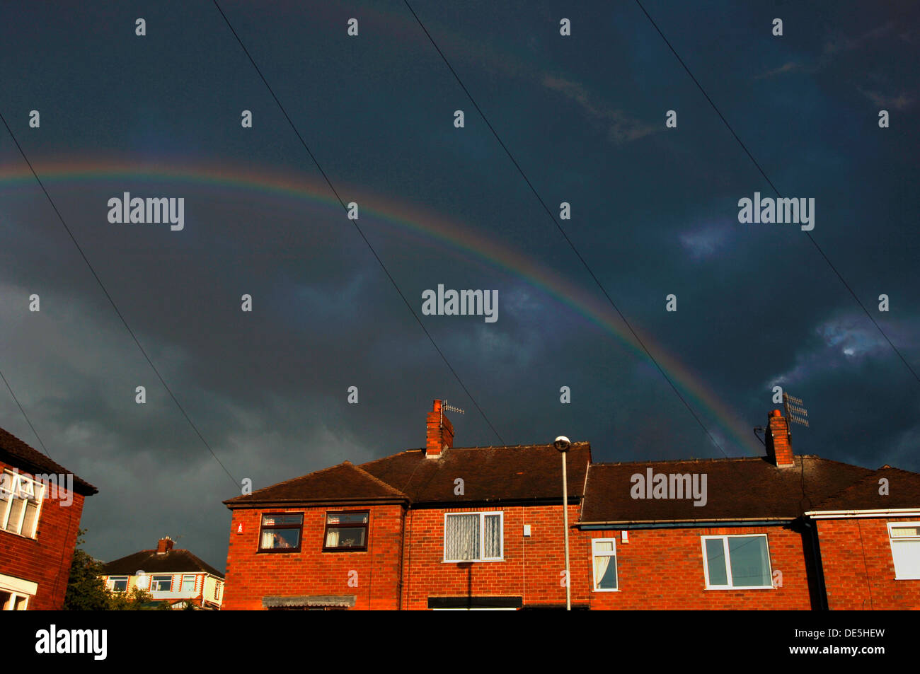 Rainbow Over Houses Stock Photo - Alamy