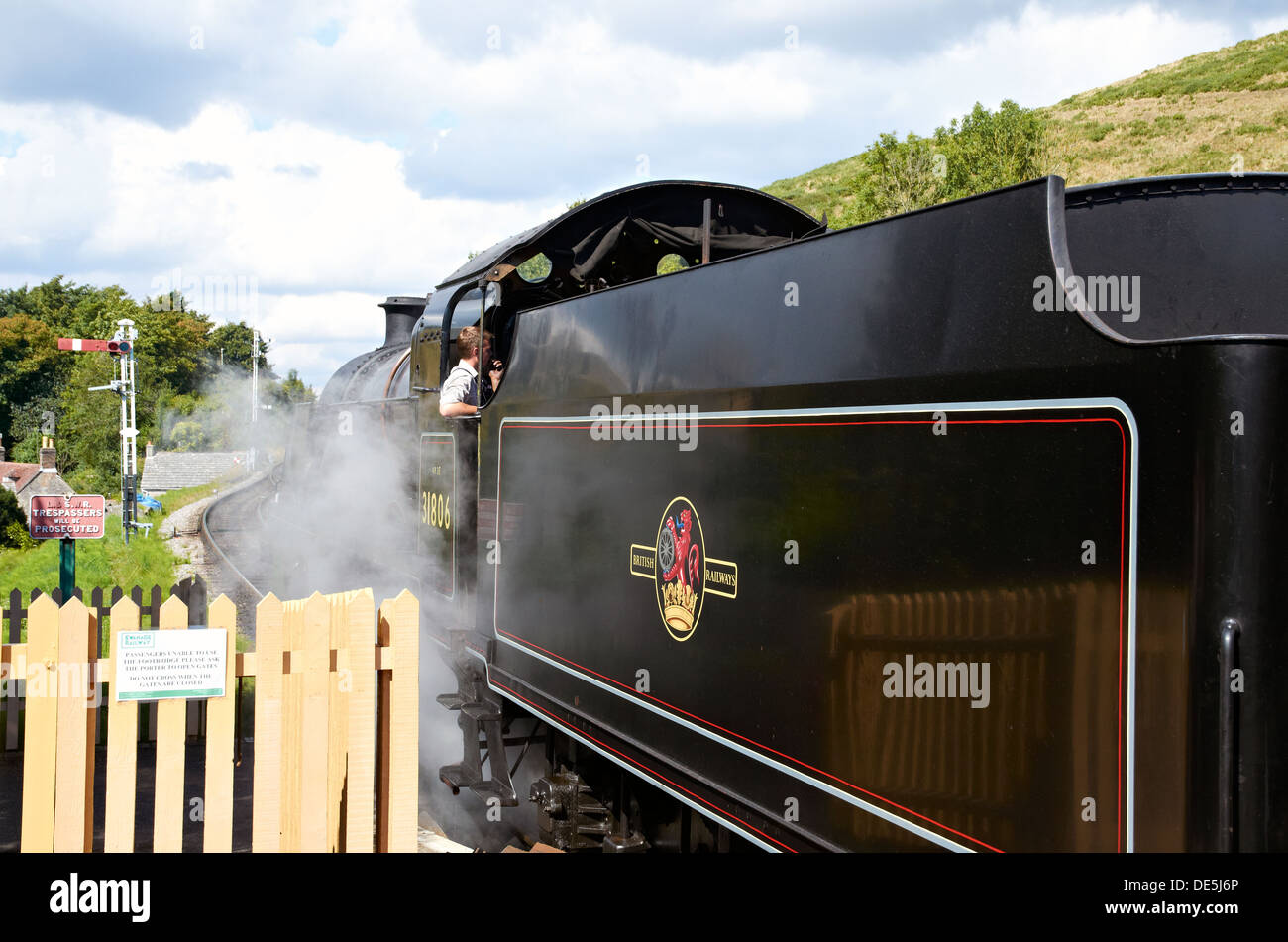 Steam train on the Swanage Railway waiting at Corfe Castle station ...