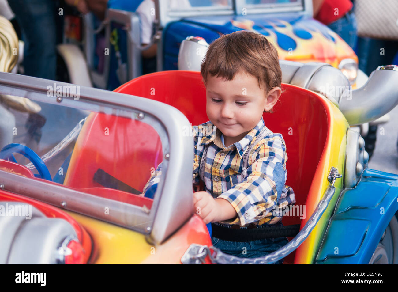 Boy riding in toy car hi-res stock photography and images - Alamy